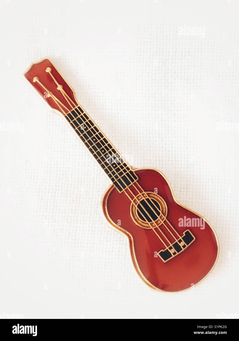 Ukulele enamel pin brooch Stock Photo - Alamy