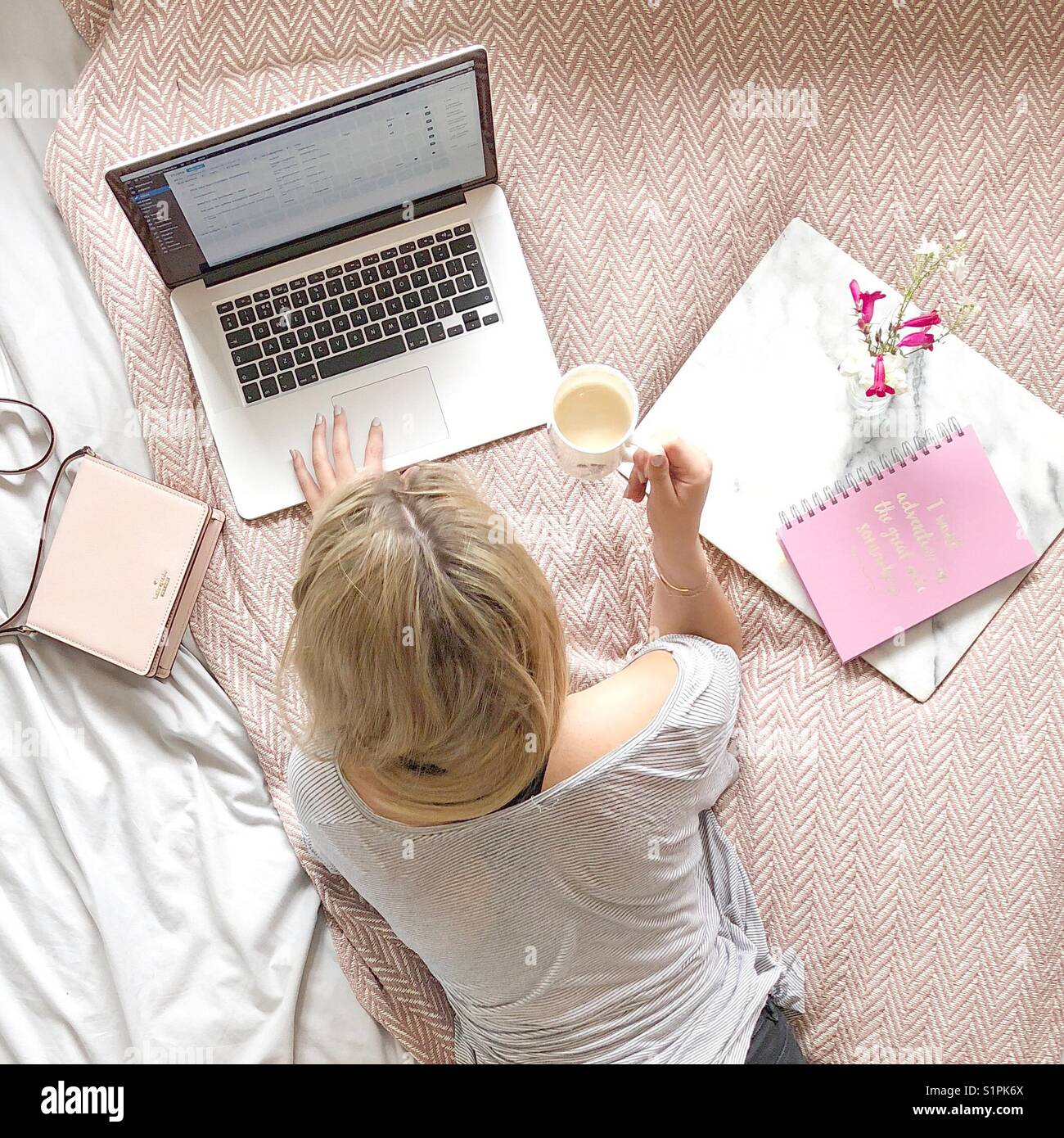 Lady working on laptop in bed Stock Photo - Alamy