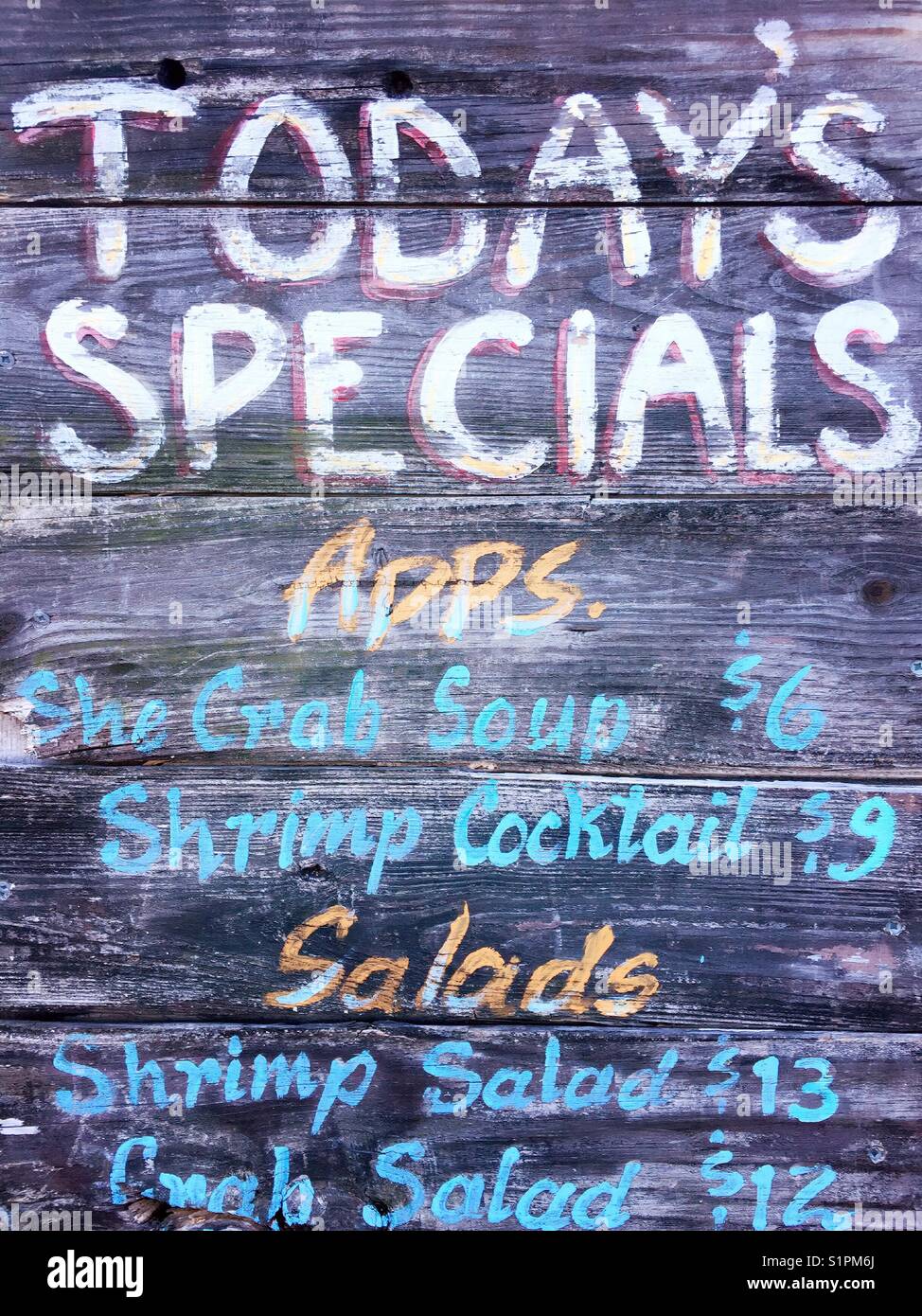 Rustic wooden menu board on casual seafood restaurant, South Carolina ...