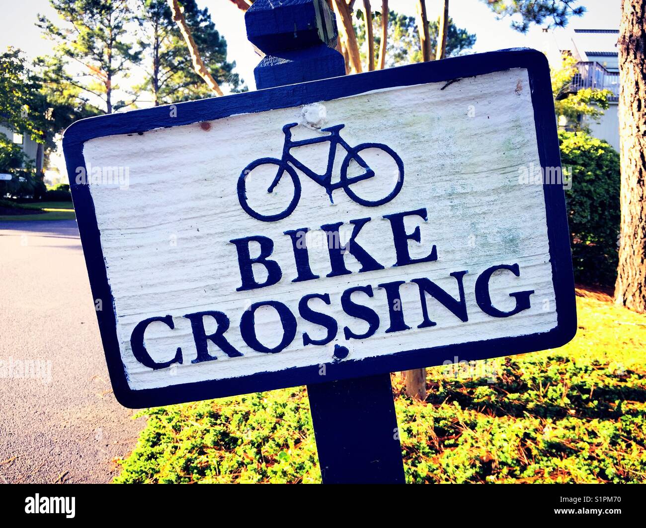 Wooden vintage bike crossing sign with pictogram bicycle, USA Stock ...