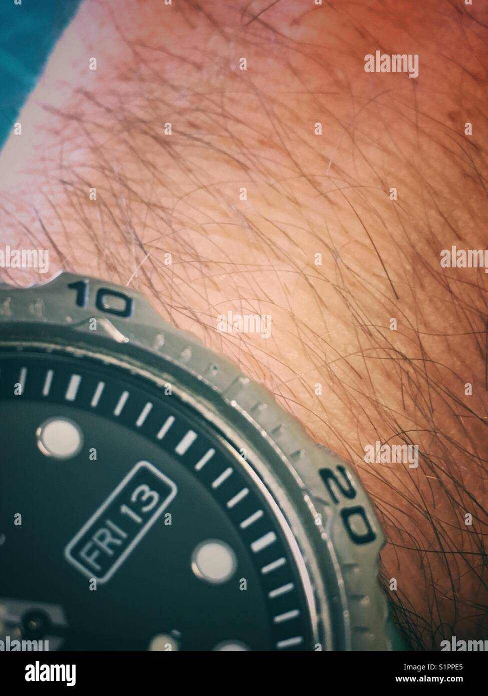 Friday the 13th shown on a watch day and date Stock Photo - Alamy