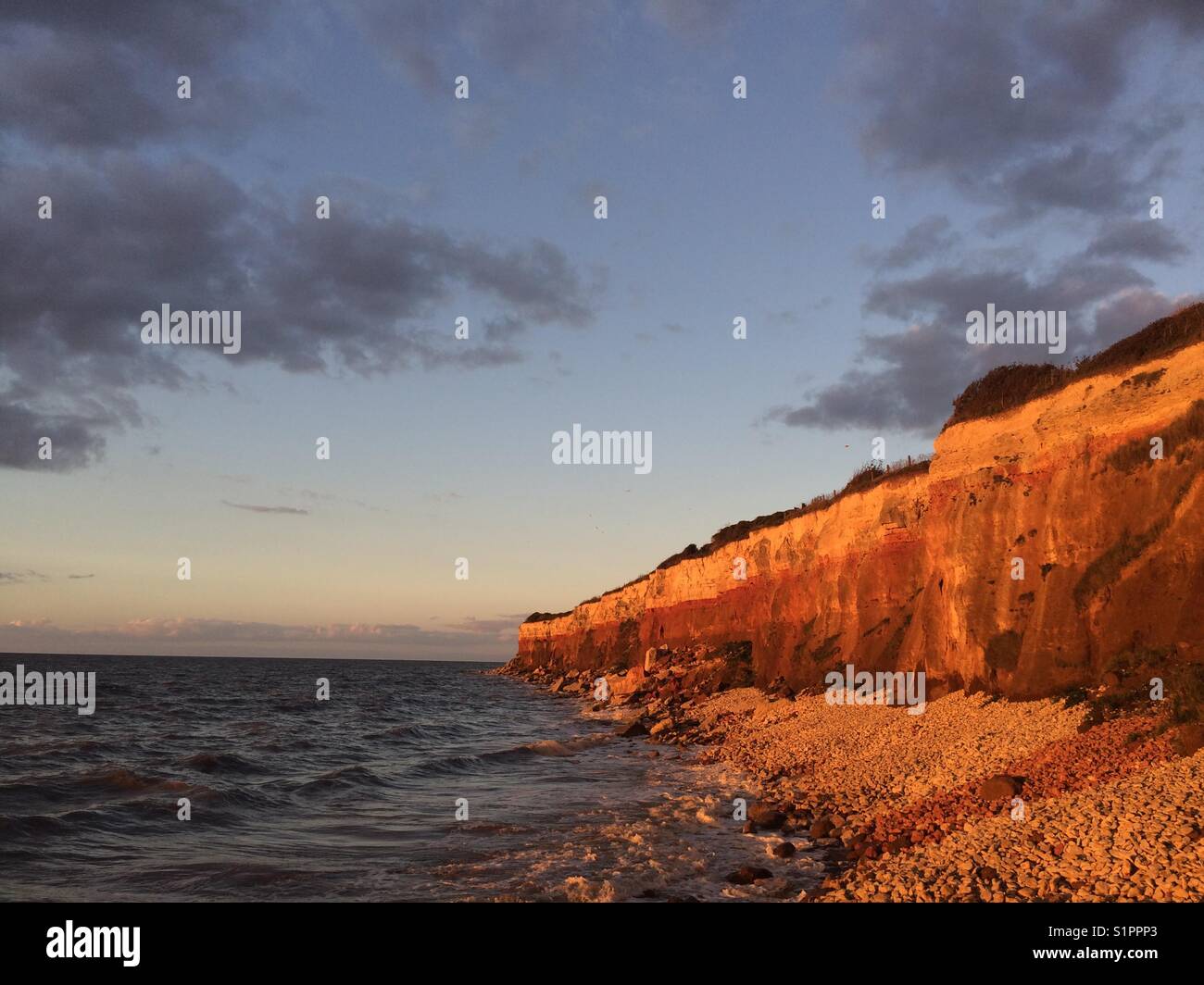 Hunstanton cliffs at sunset Stock Photo - Alamy