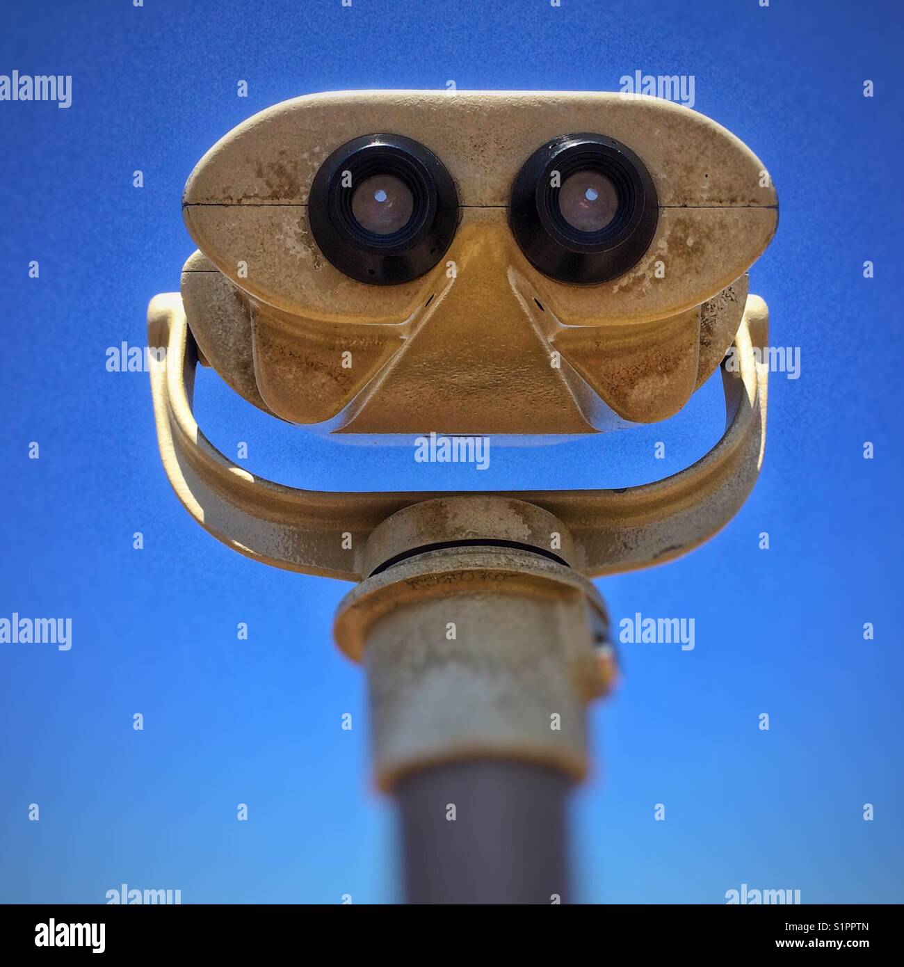 Sightseeing binoculars on blue sky background Stock Photo - Alamy
