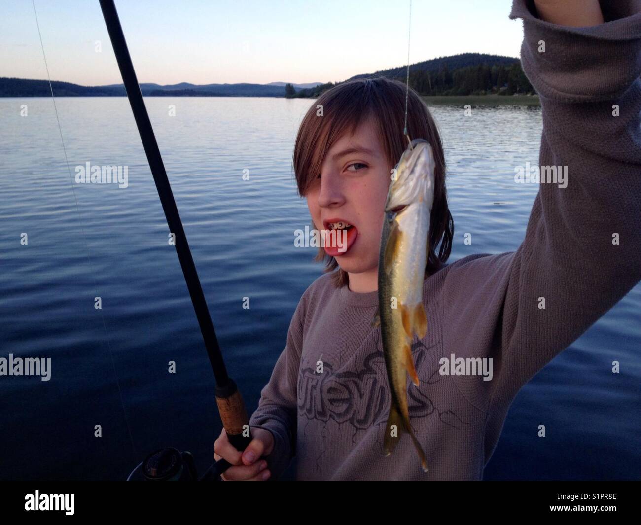Boy fishing hi-res stock photography and images - Alamy