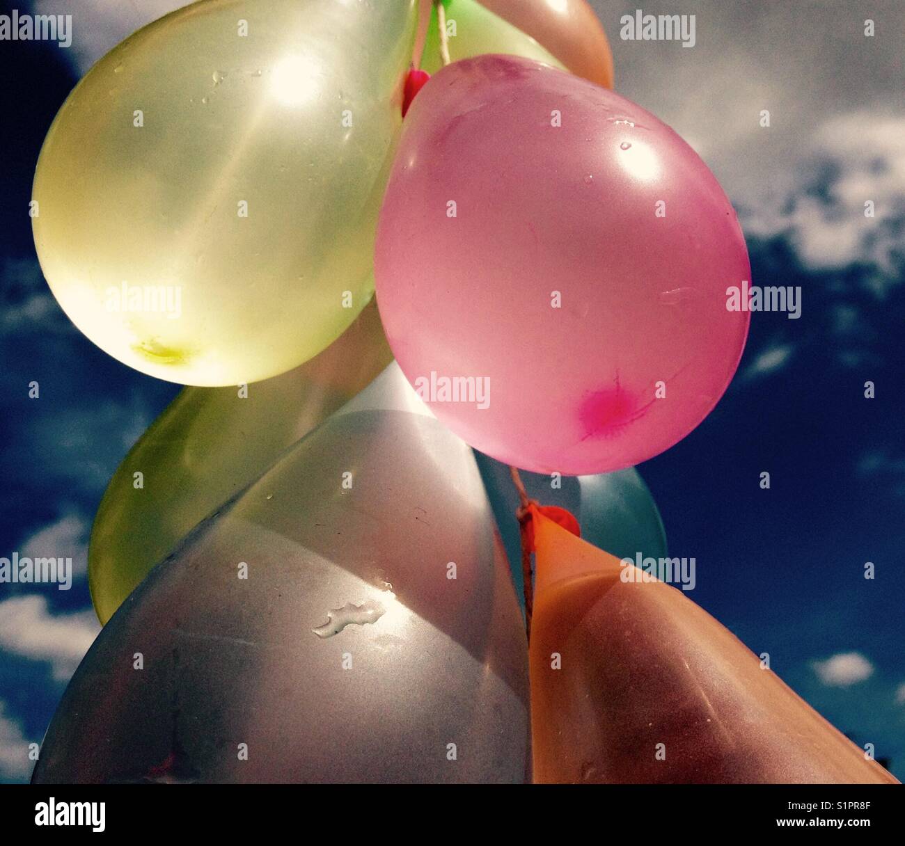Balloons hanging up Stock Photo - Alamy