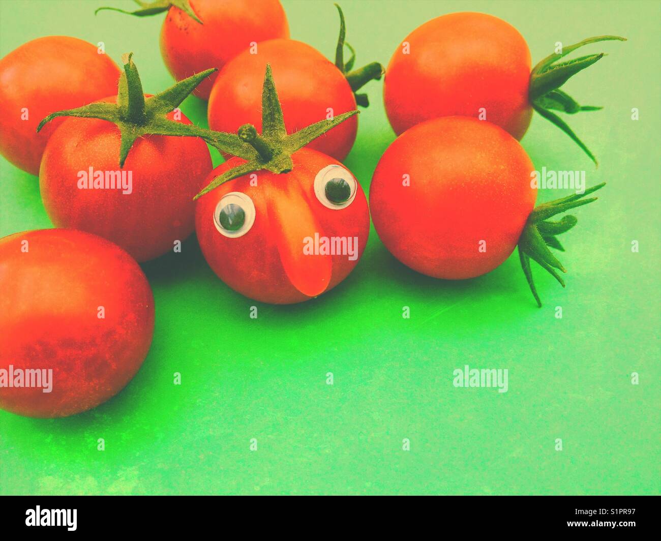 Tomato with a funny face Stock Photo - Alamy
