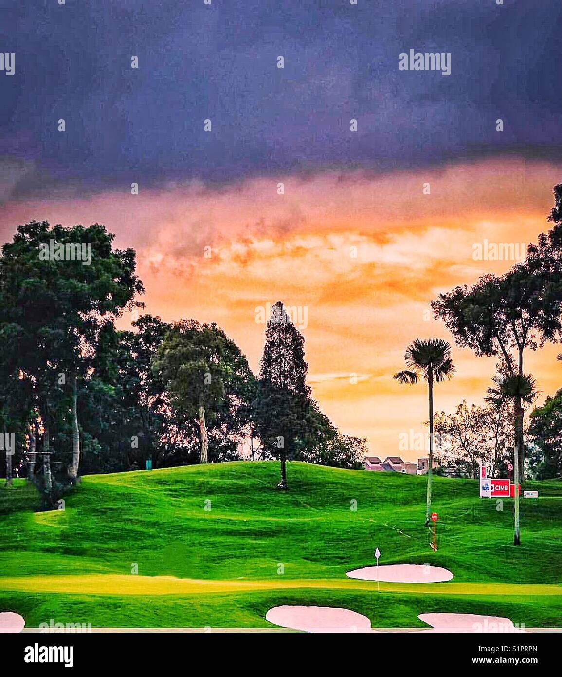 Sunrise over a golf course Stock Photo - Alamy