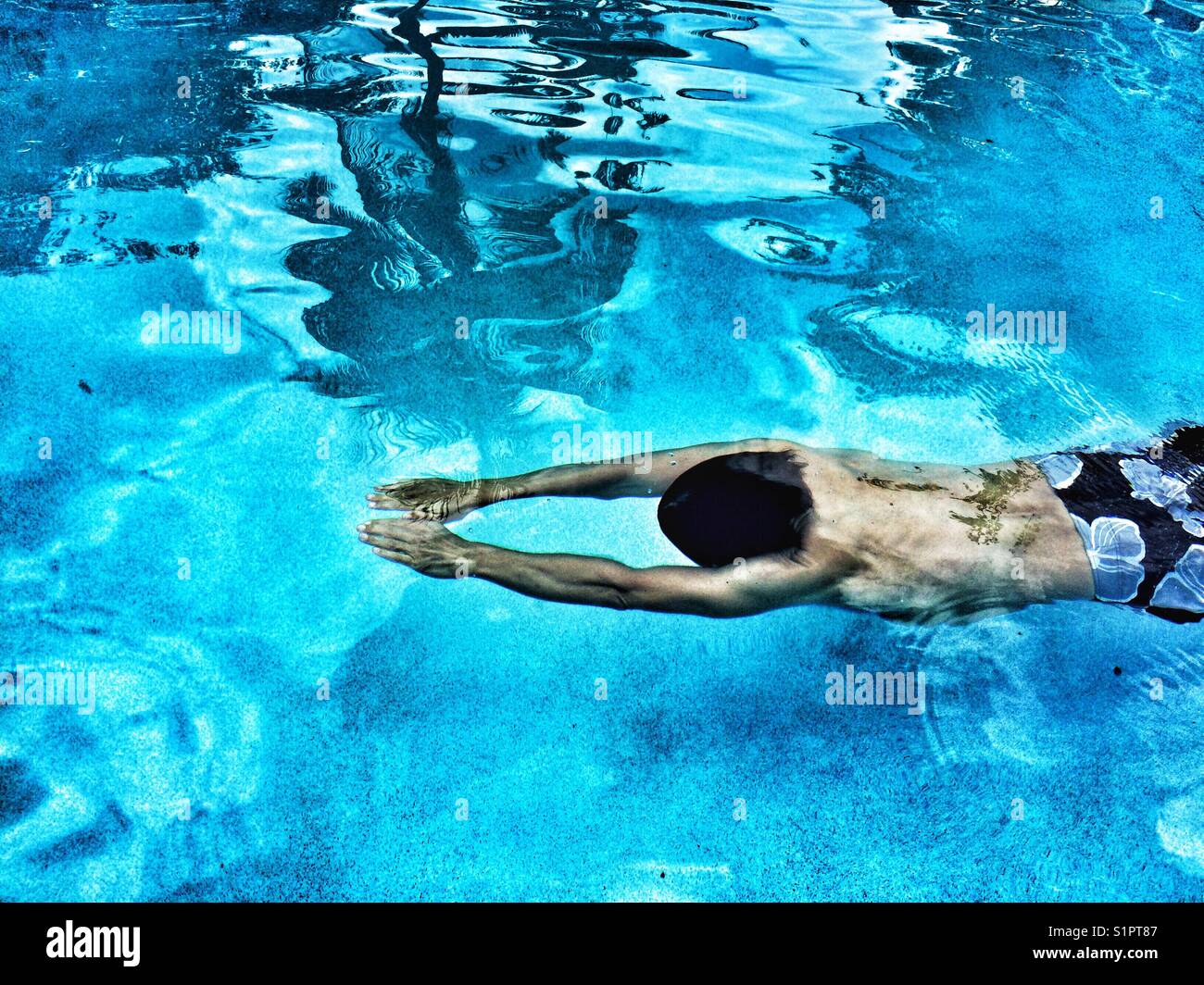 Man diving into pool Stock Photo - Alamy