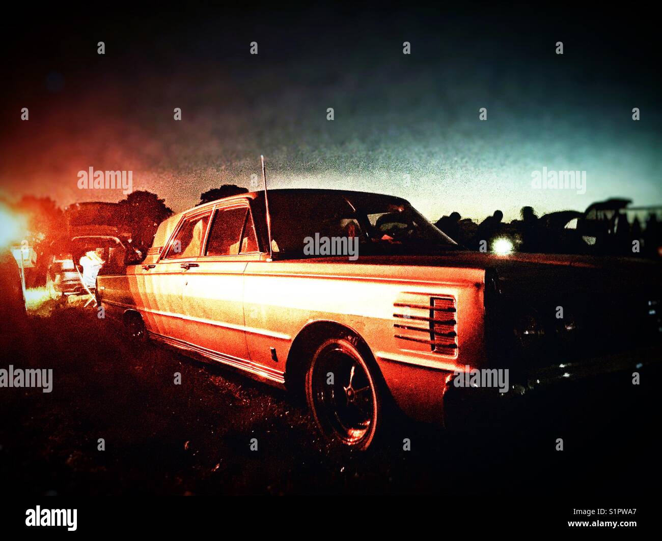 A vintage American car at night Stock Photo - Alamy