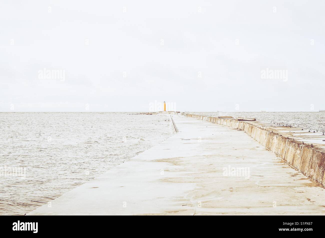A lighthouse far away in sea Stock Photo - Alamy