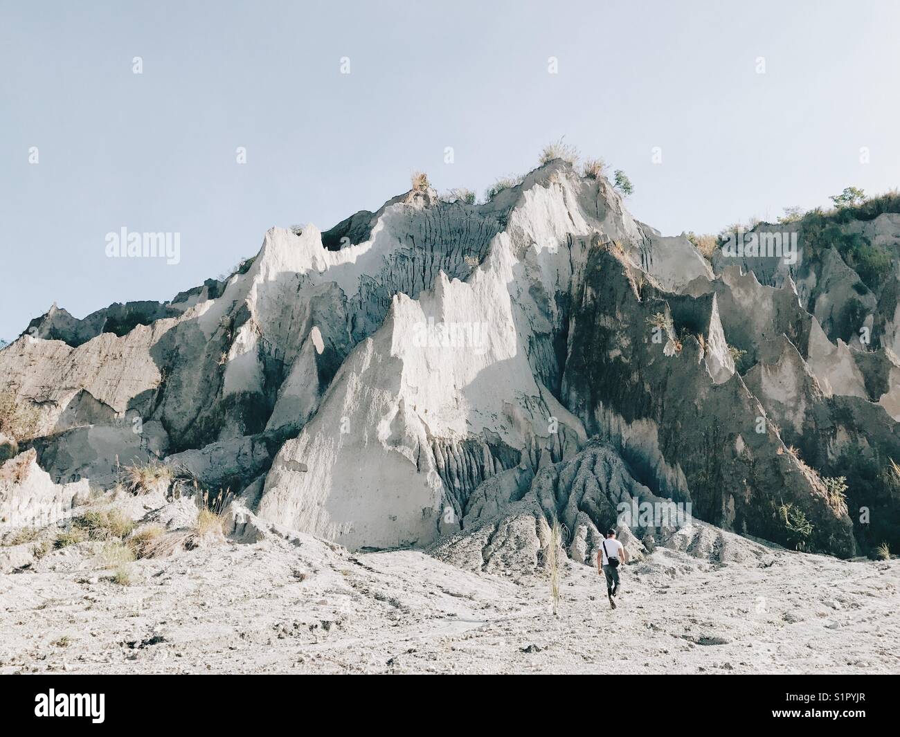 Walls of ash and rock formations along a rugged trail Stock Photo - Alamy