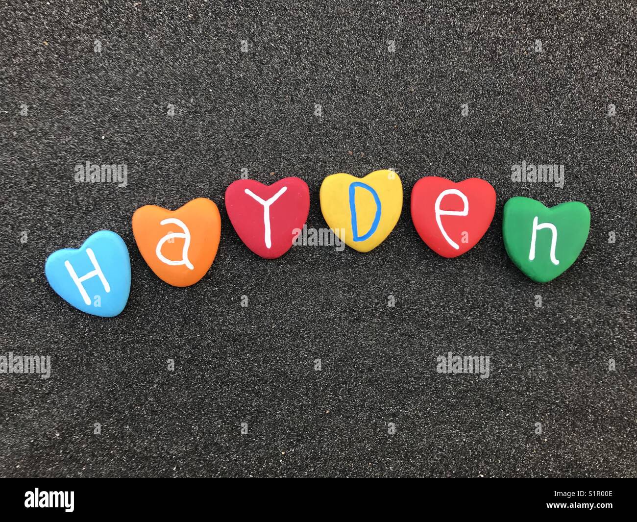 Hayden, female and male given name with colored heart stones over black ...
