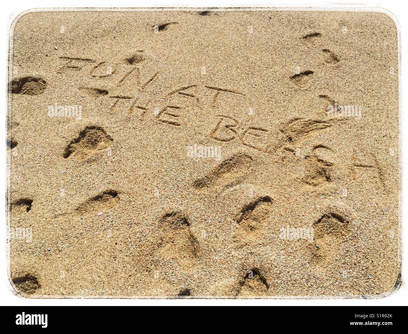 Fun at the beach written in the sand Stock Photo - Alamy