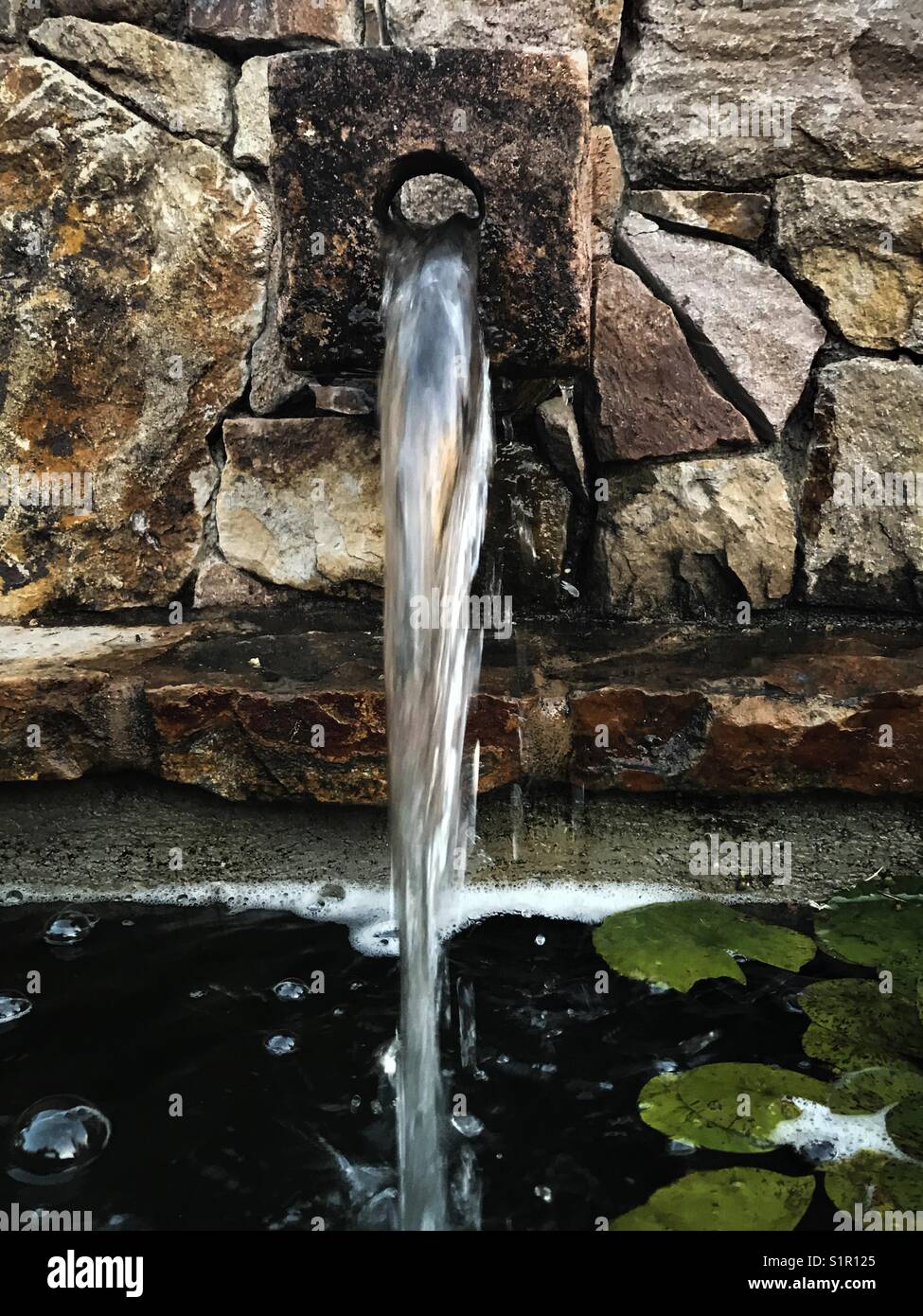 Stone water fountain Stock Photo - Alamy