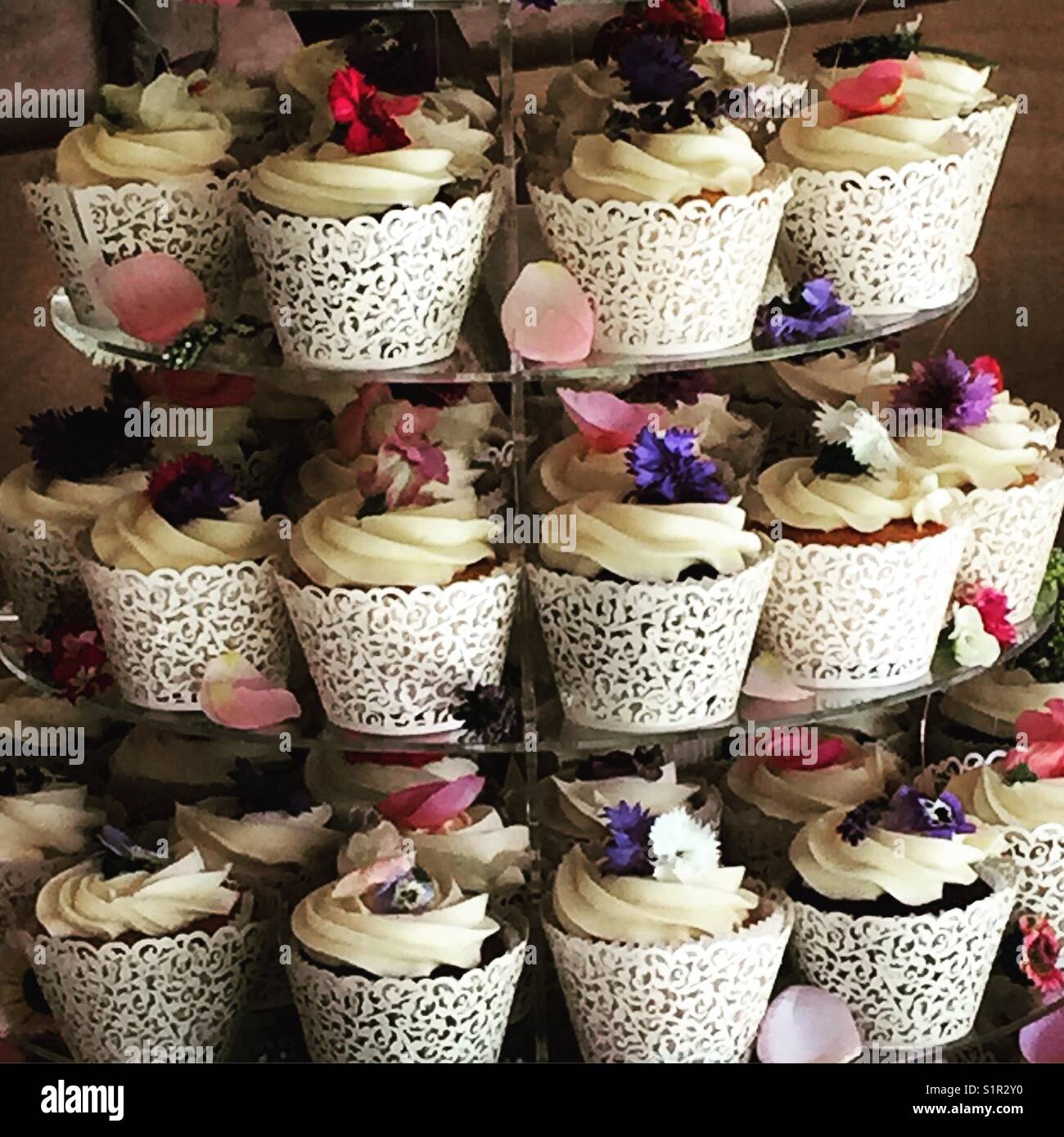 Three tiers of wedding cupcakes on a stand Stock Photo - Alamy