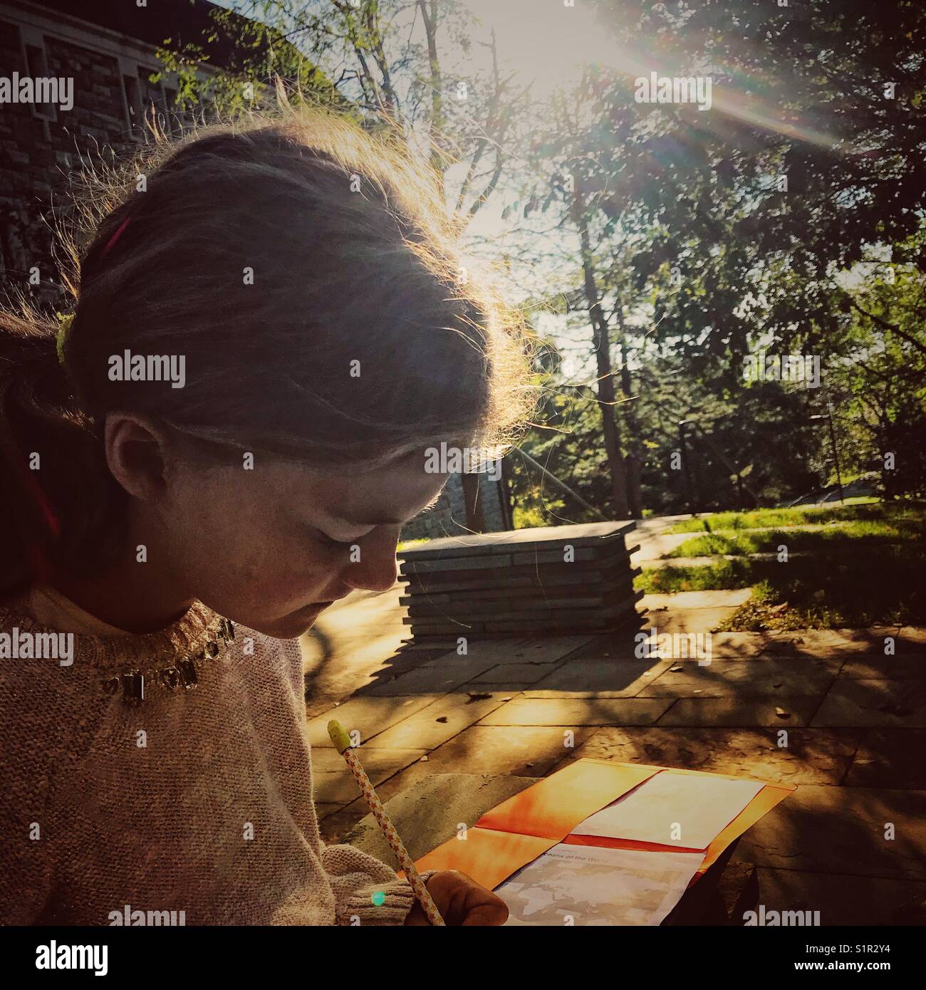 Finishing homework on a small college campus Stock Photo - Alamy