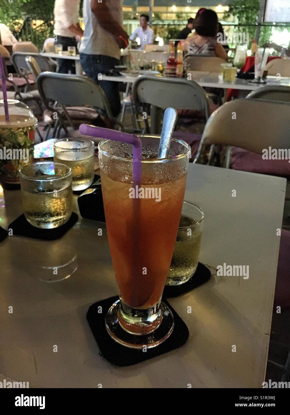 Drinking tea at a local cafe shop in ho chi minh city Stock Photo - Alamy
