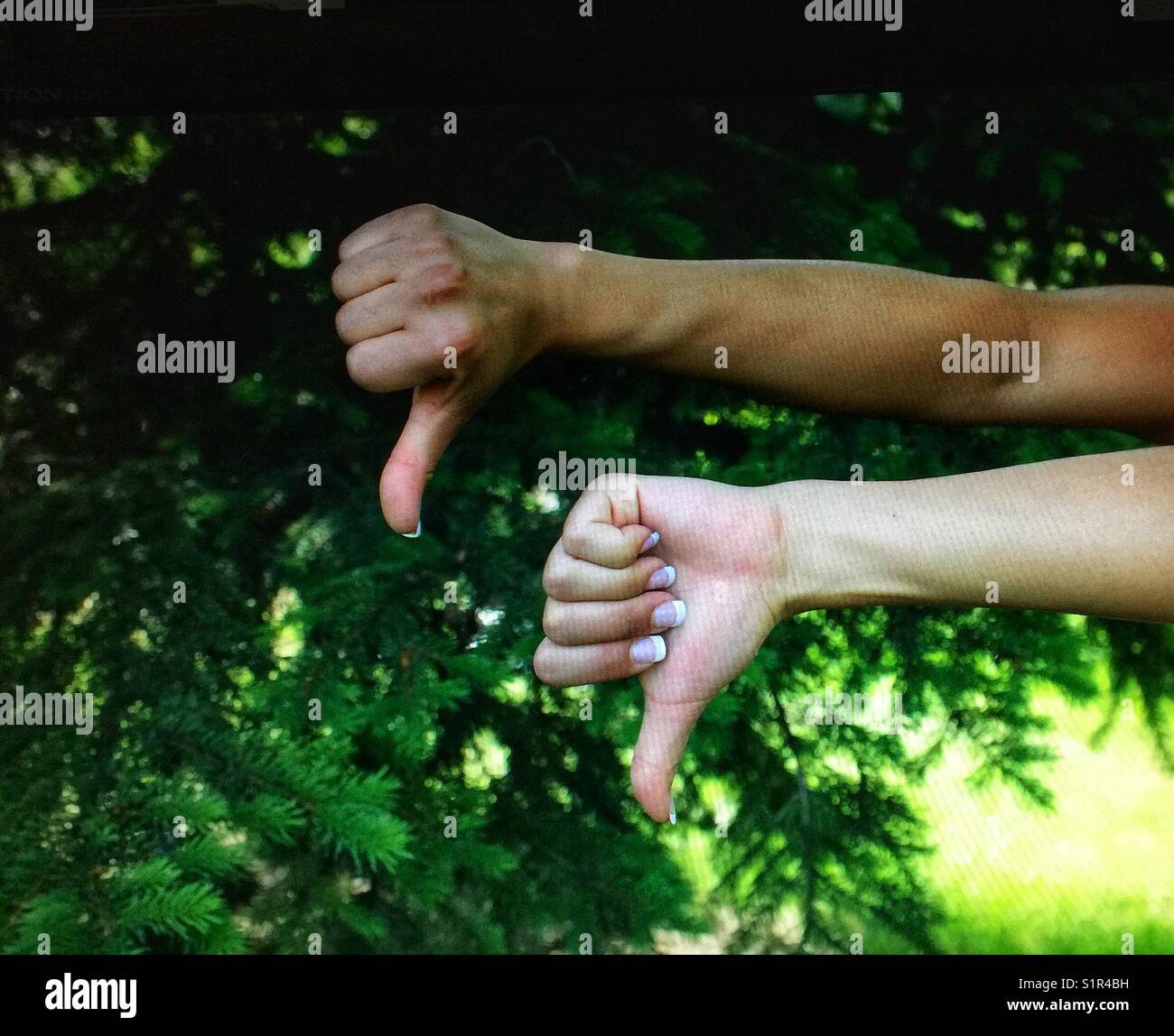 Two Thumbs down Stock Photo - Alamy