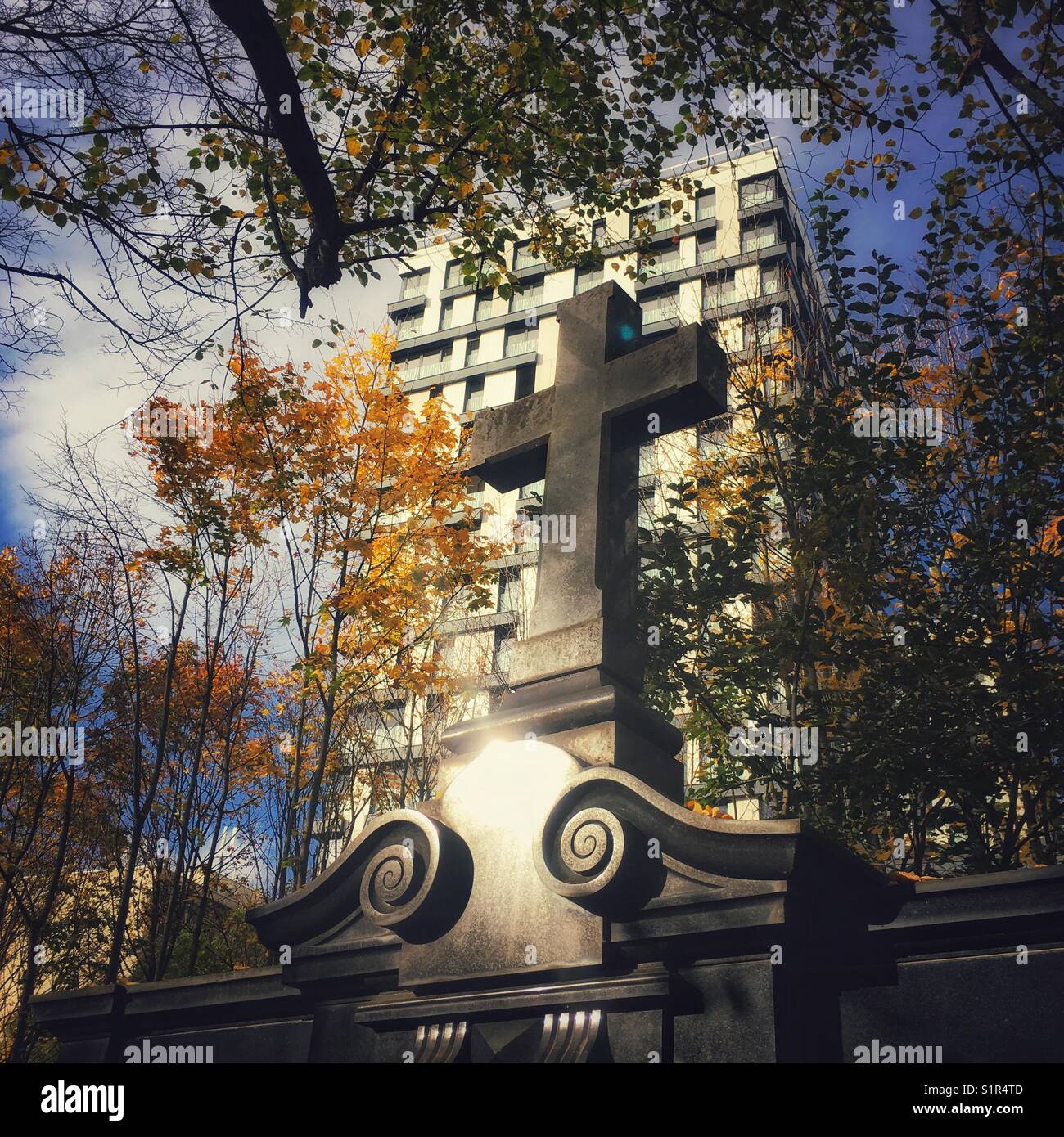 View of a grave with a cross. Olsany cemetery. Zizkov, Prague Czech ...