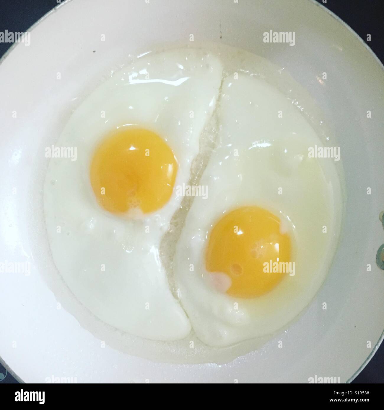 Two fried eggs Stock Photo - Alamy