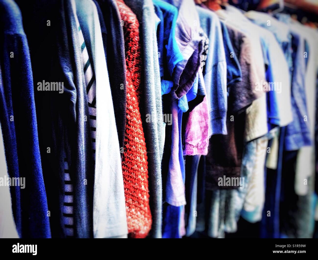 Clothes on a rail Stock Photo - Alamy