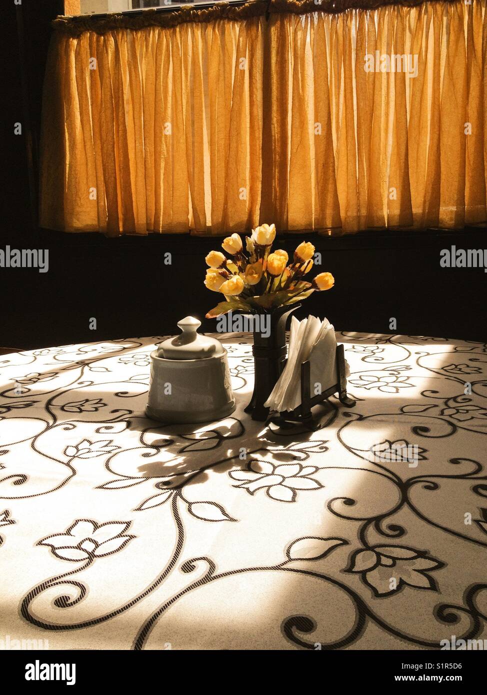 Tea time. Table with flowers, sugar pot and napkins Stock Photo - Alamy