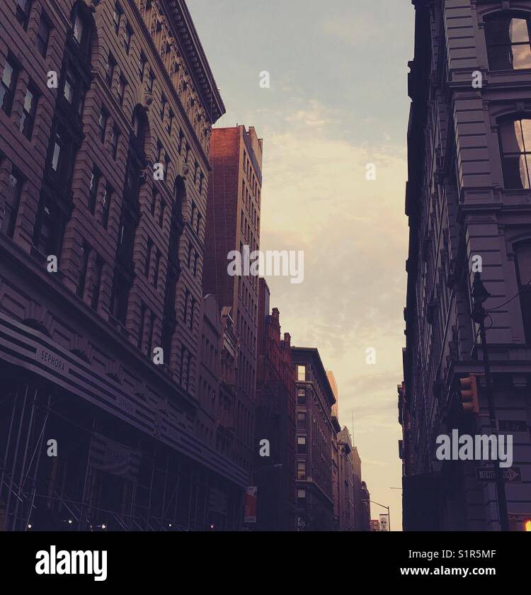 Sightline between buildings in NYC at sunset Stock Photo - Alamy