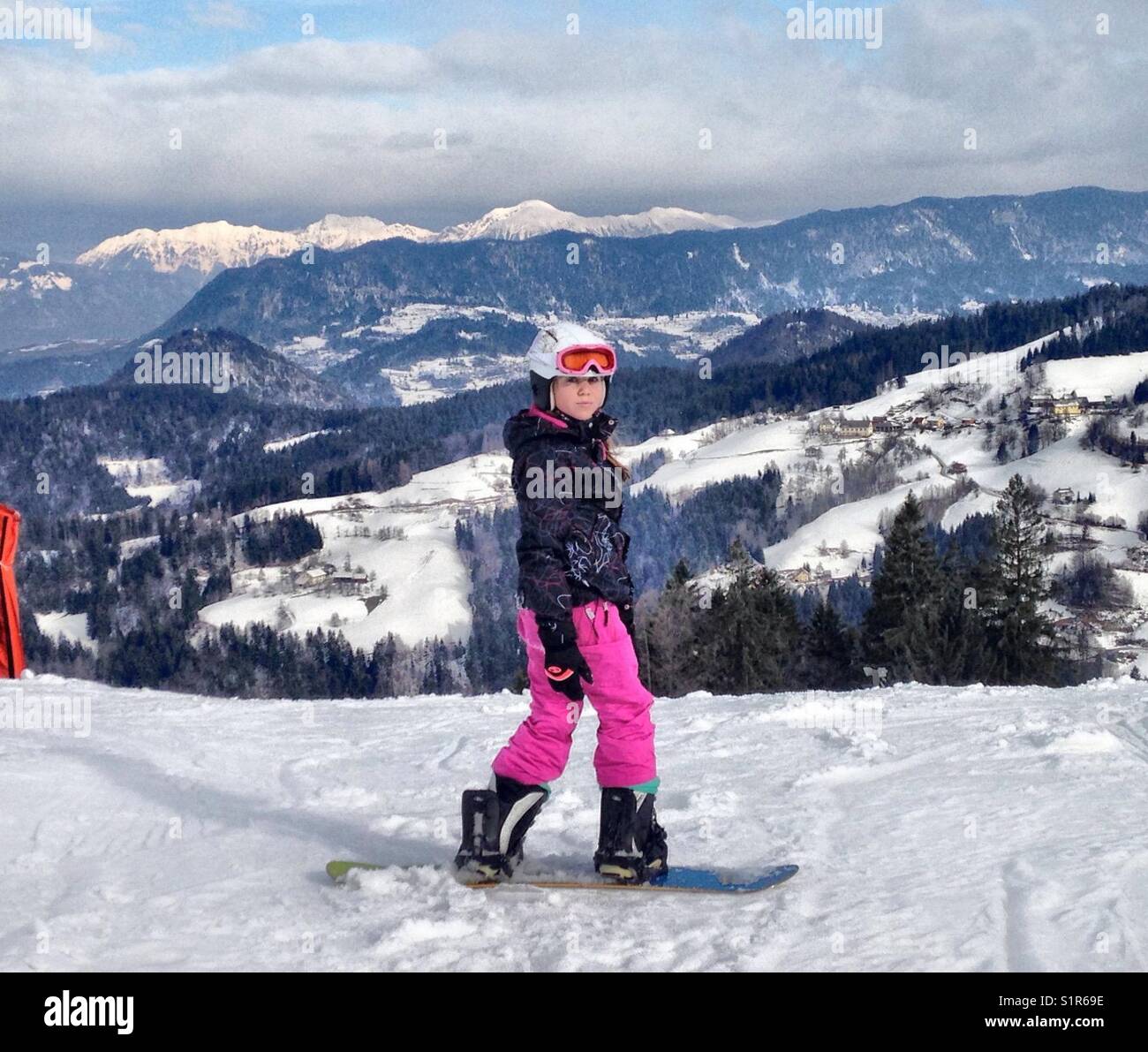 Young girl on snowboard Stock Photo - Alamy