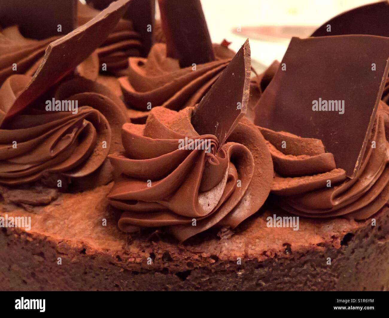 Icing over chocolate cake Stock Photo - Alamy