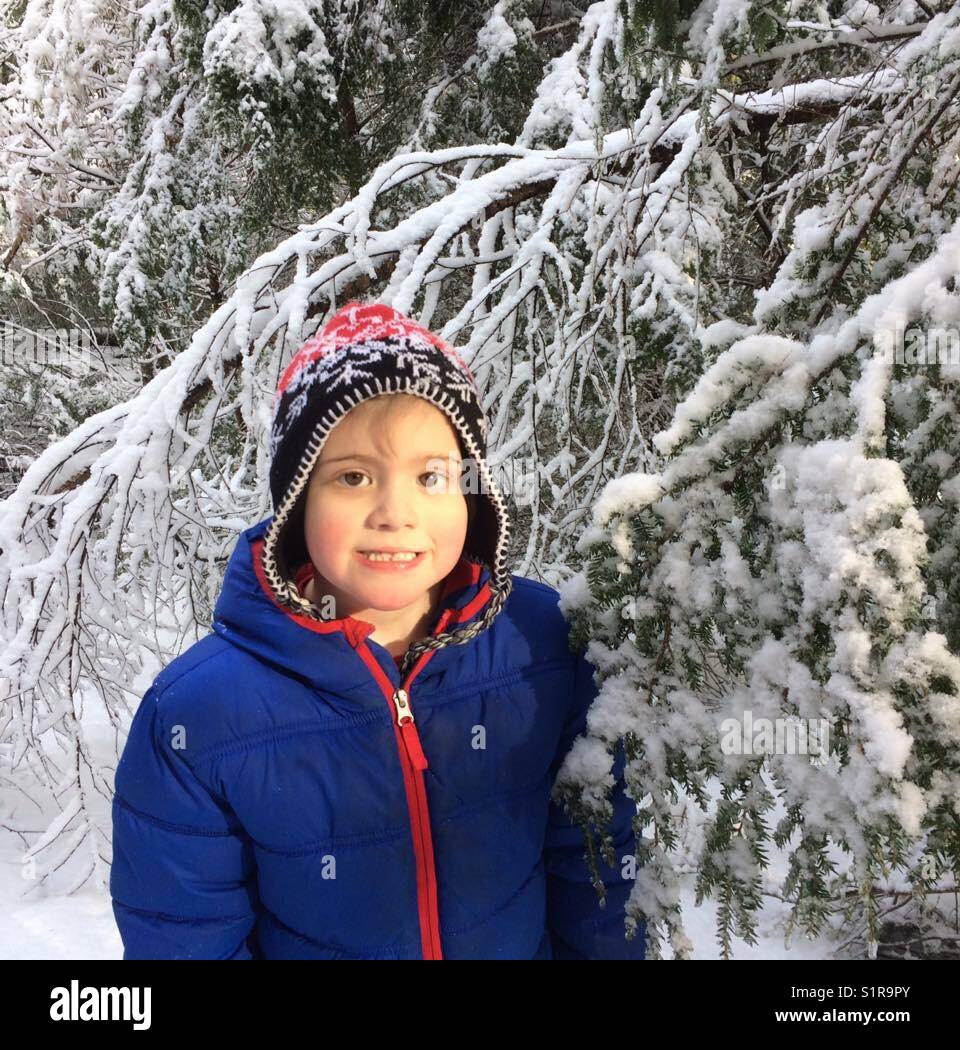 Boy in the snow Stock Photo - Alamy