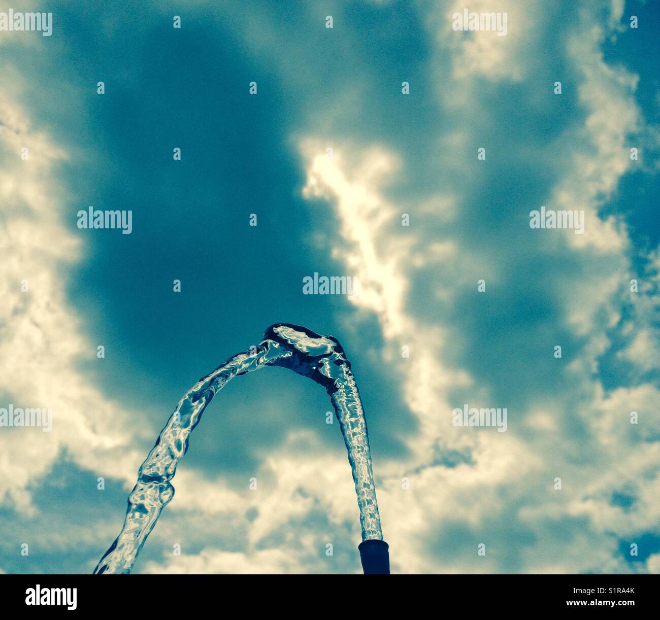 Water spurting out of a balloon Stock Photo - Alamy