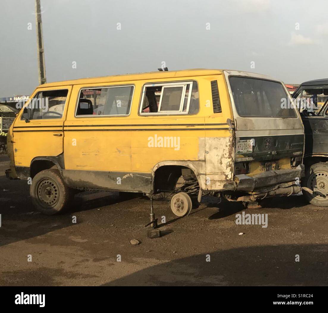 Lagos taxi has wheel problem Stock Photo - Alamy