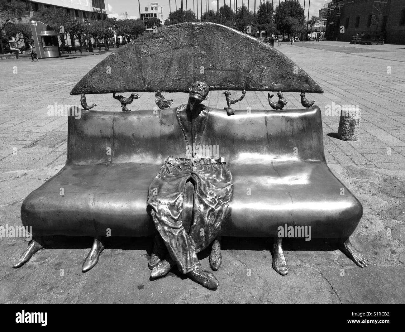 Deflated man on coach Stock Photo - Alamy