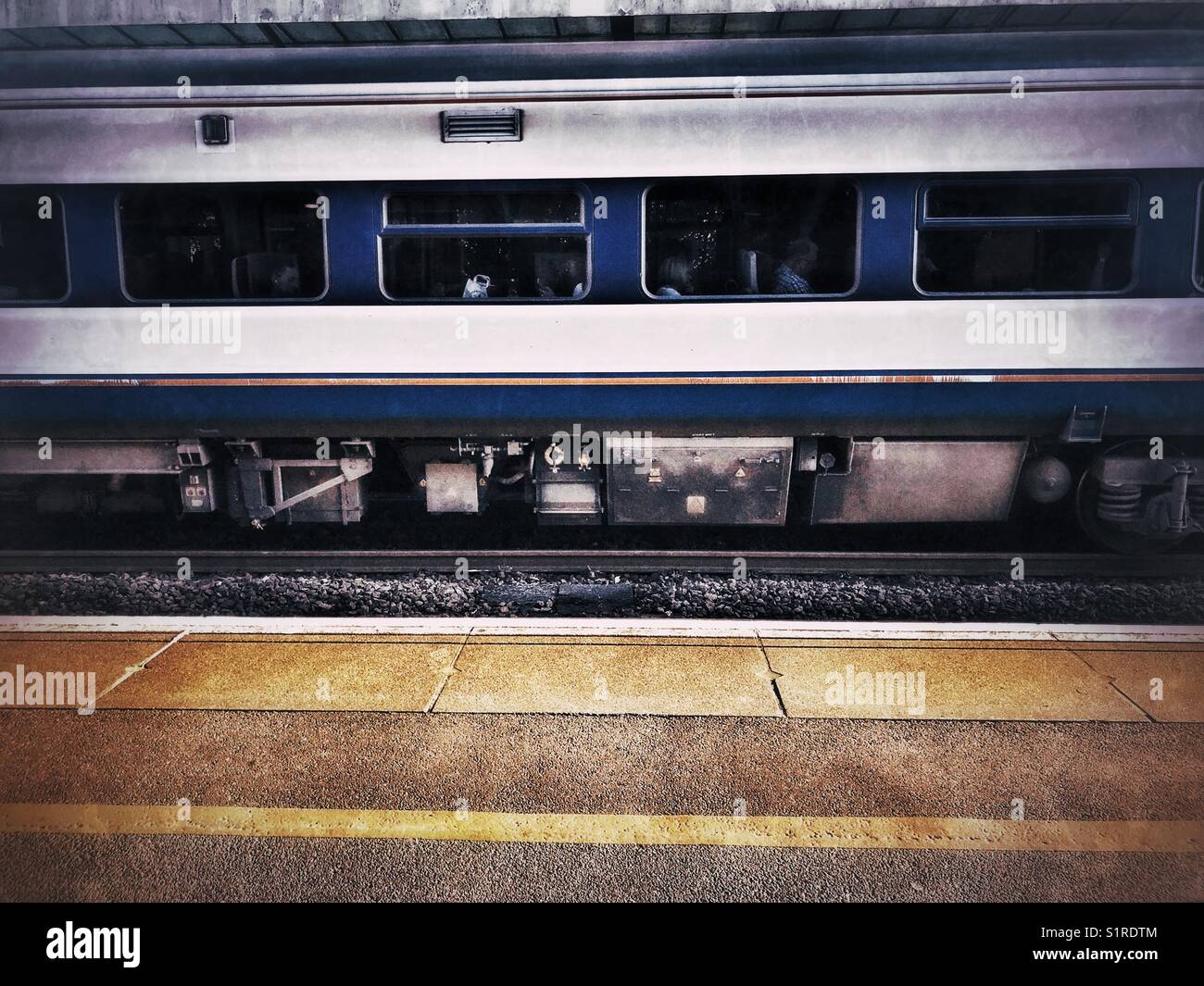 rail station platform and train in station, abstract Stock Photo - Alamy