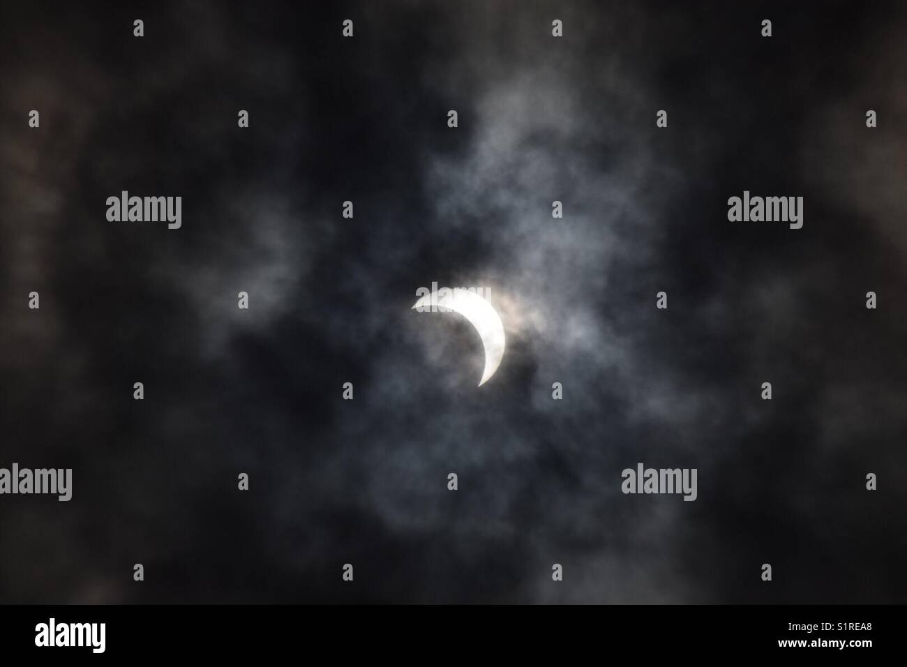 Cloudy partial solar eclipse hi-res stock photography and images - Alamy