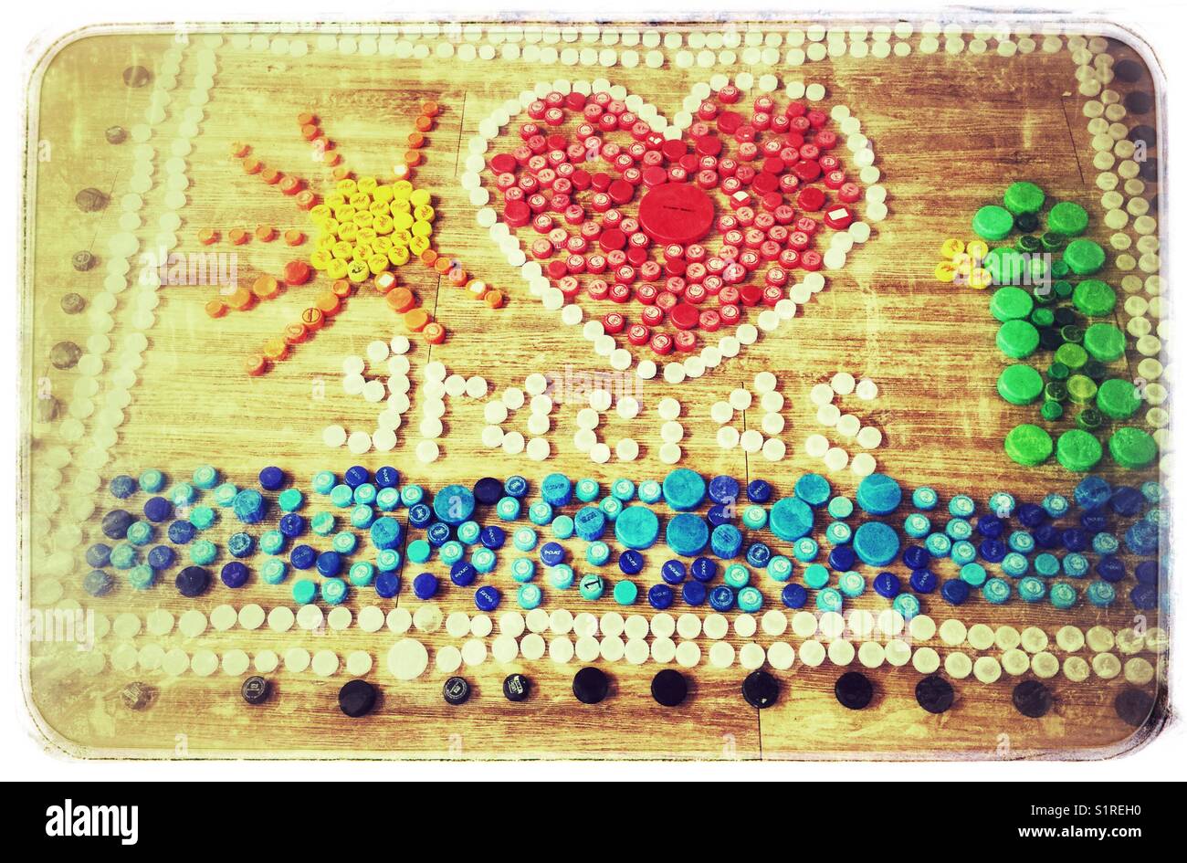 A picture created from different coloured bottle caps Stock Photo - Alamy