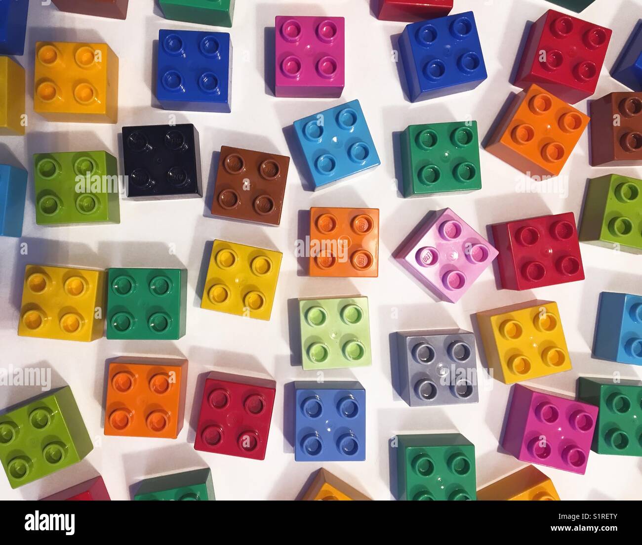 Duplo bricks in different colours spread out on a White Background ...
