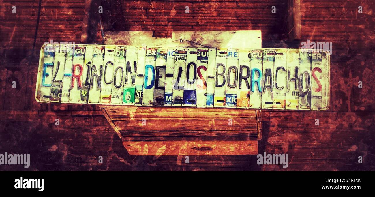 The letters of a a bar sign made out of different licence plates to ...