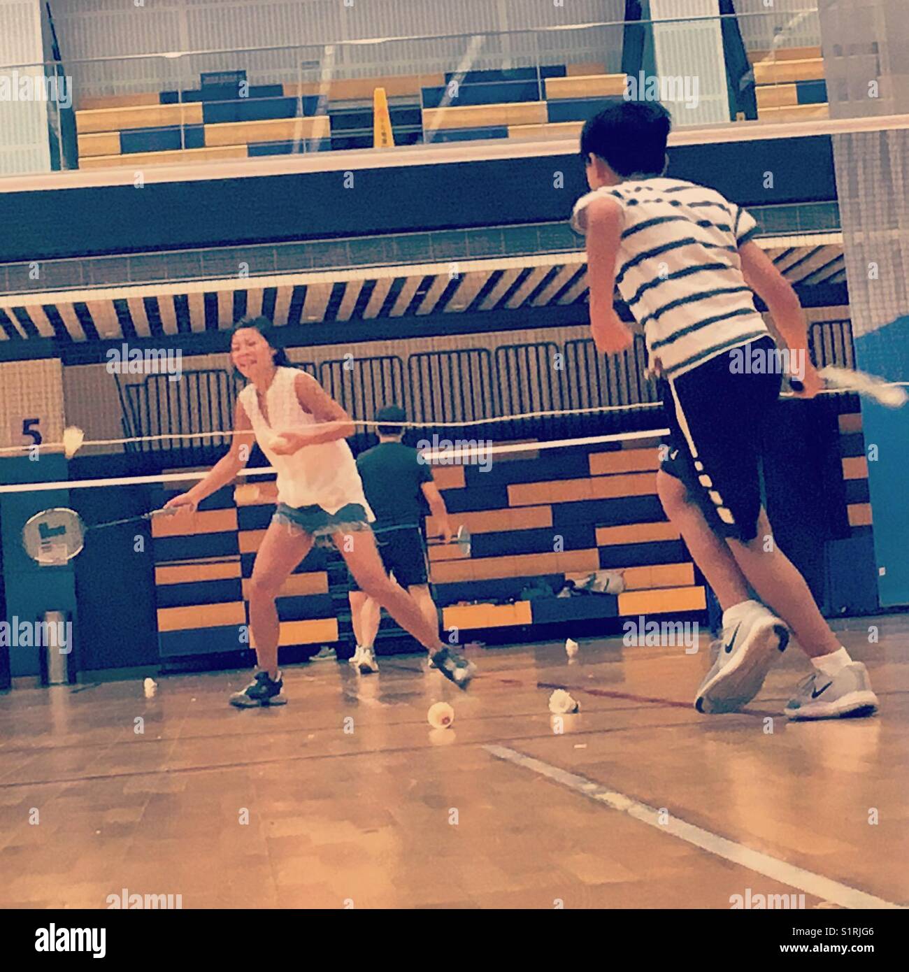 Family playing badmington Stock Photo - Alamy