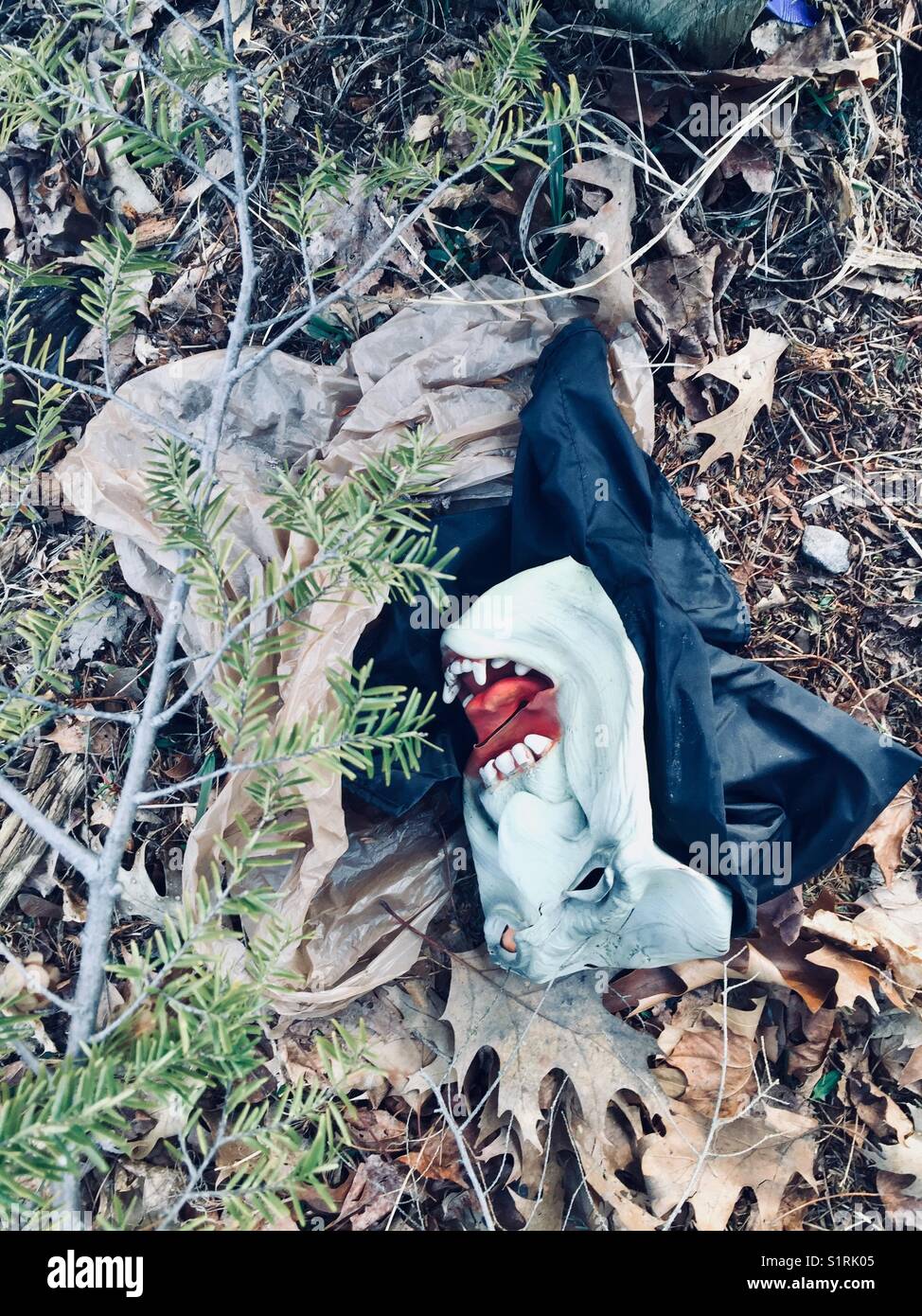 Discarded Halloween mask Stock Photo - Alamy