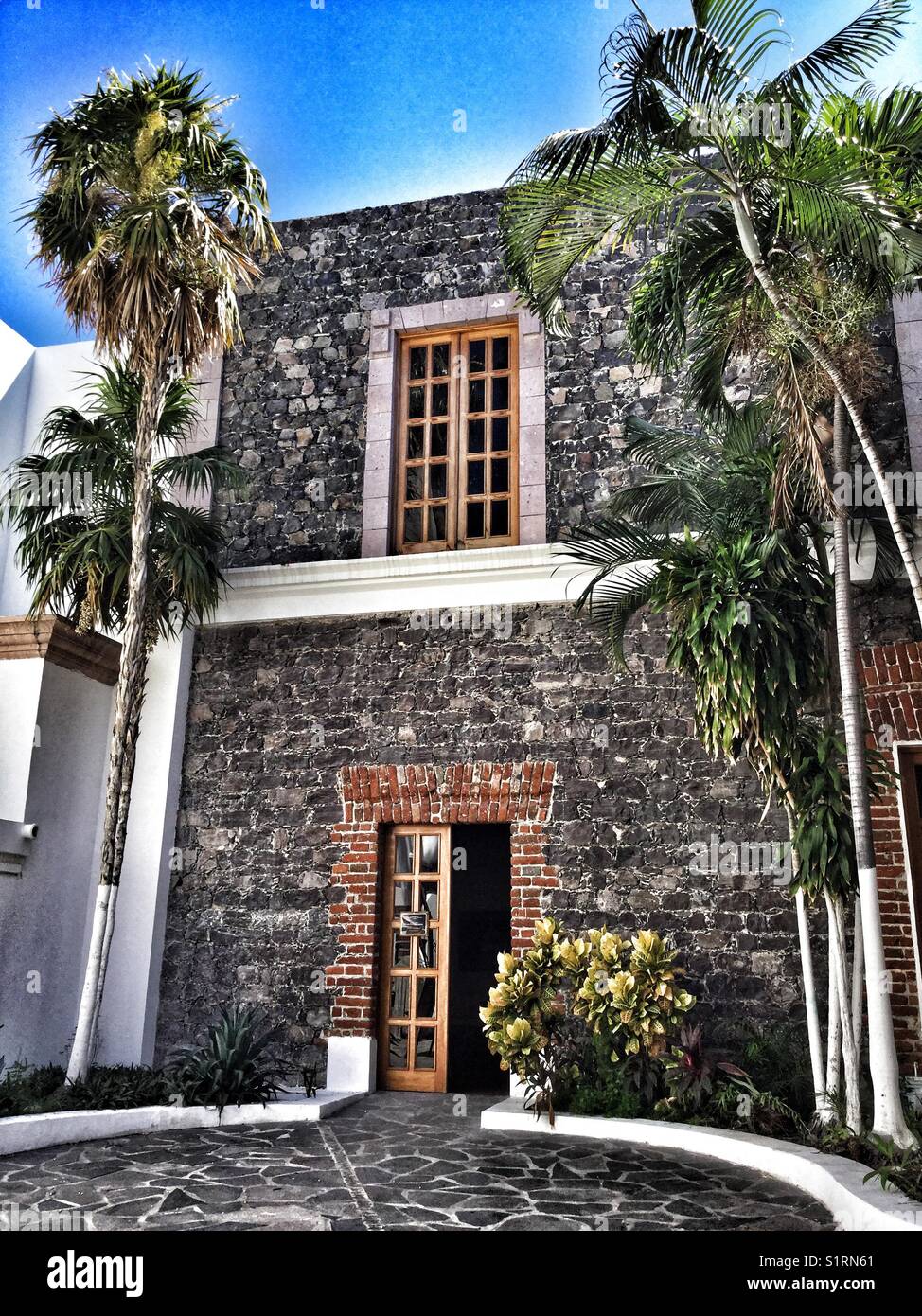 Courtyard of a stone building in Mexico Stock Photo - Alamy