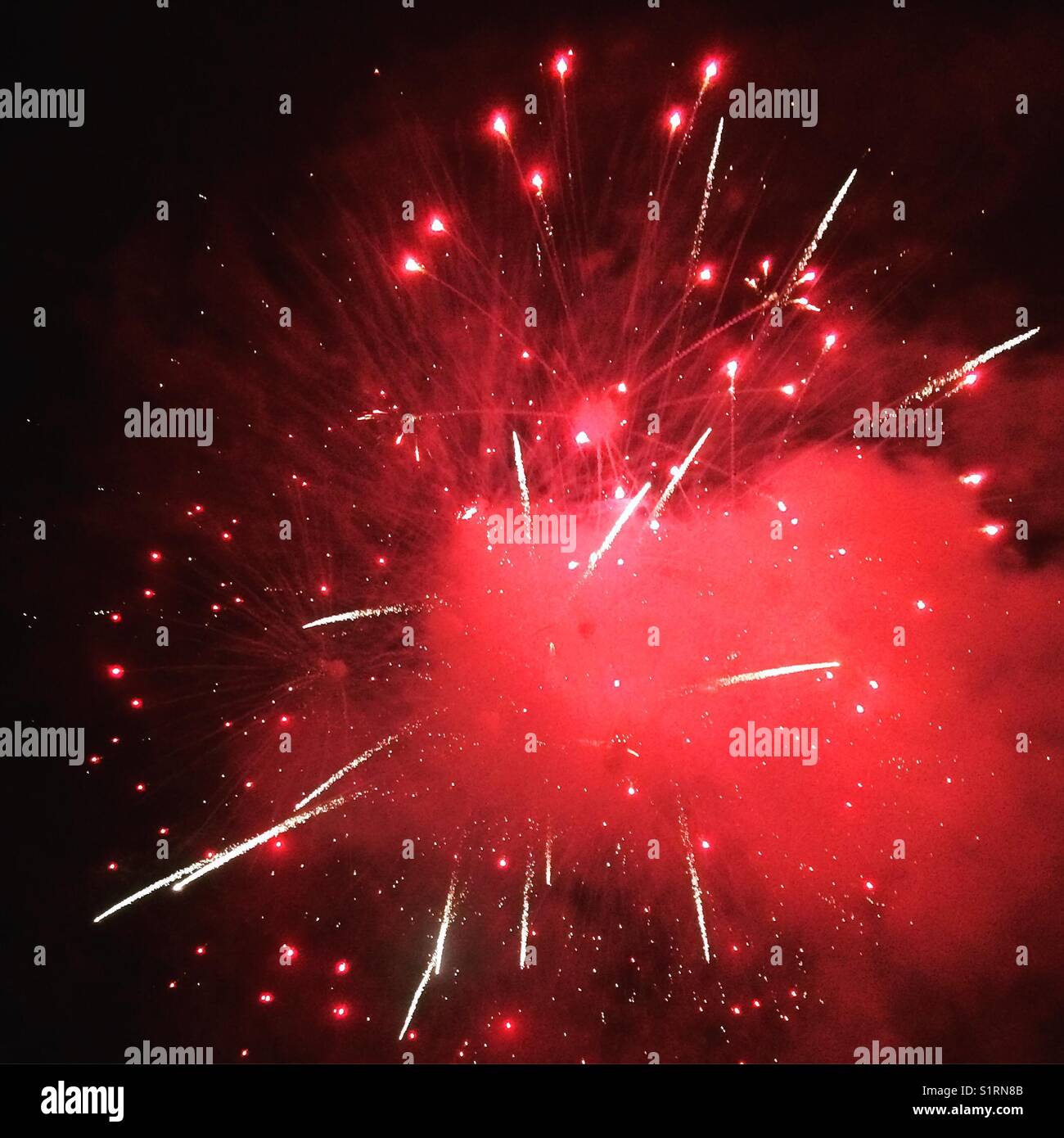 Red fireworks explosion Stock Photo - Alamy