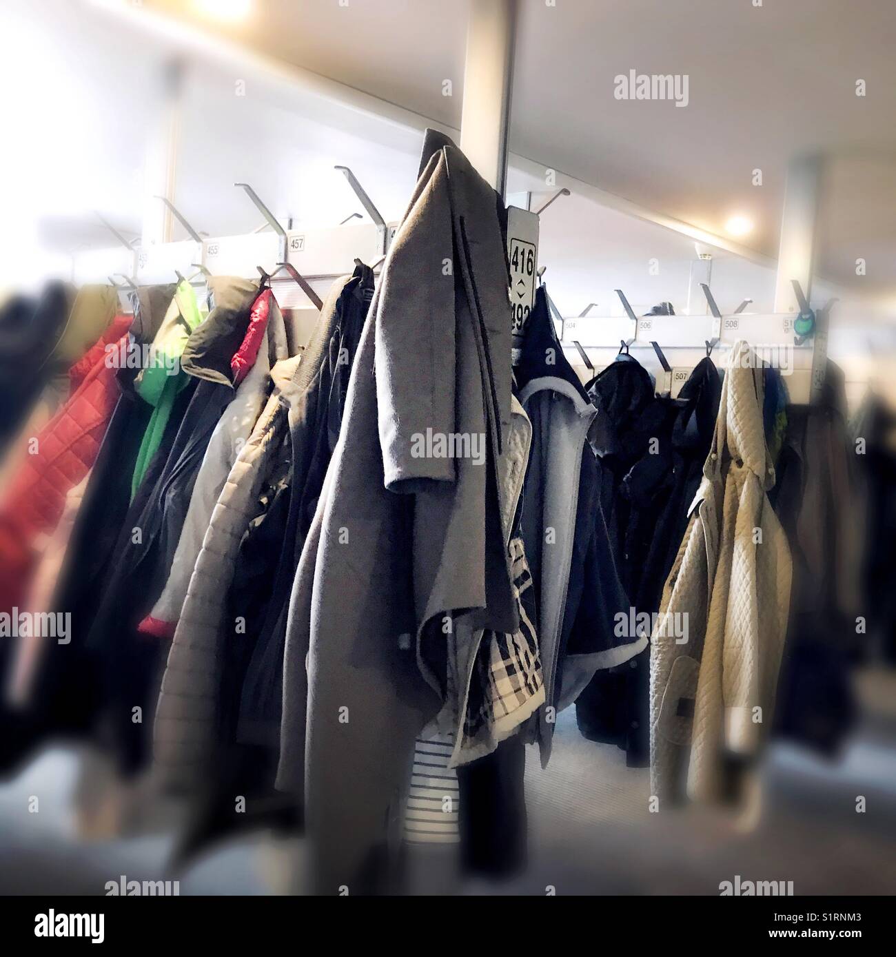 Cloakroom with coats hi-res stock photography and images - Alamy