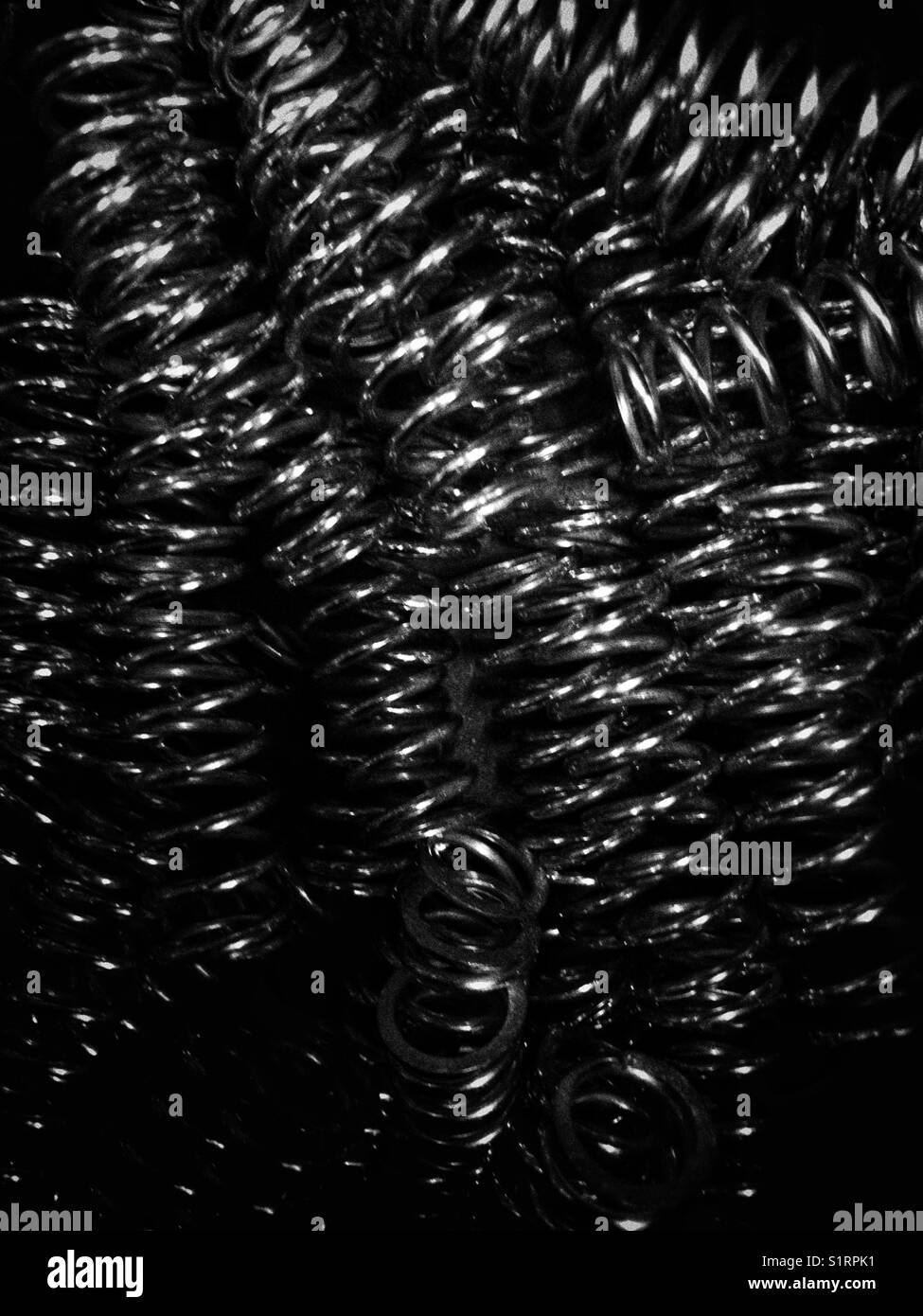 Pile metal springs hi-res stock photography and images - Alamy