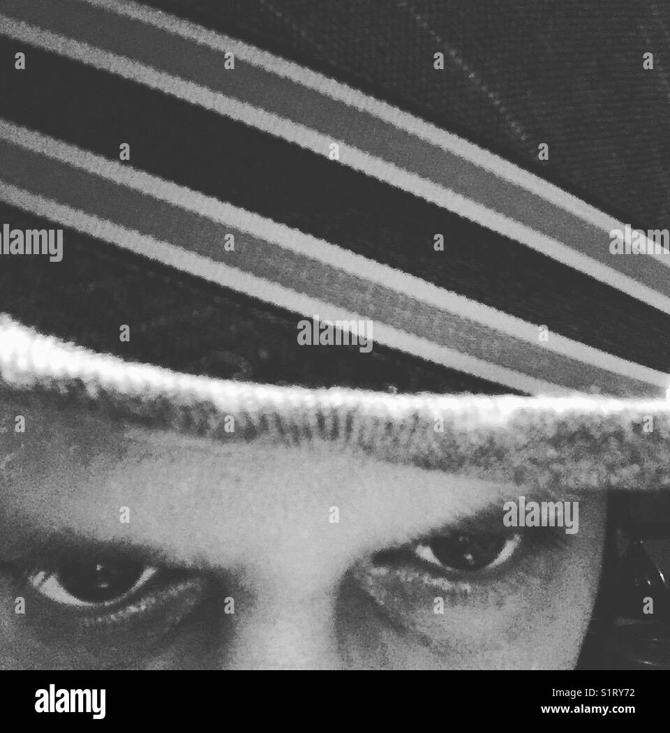 The eyes of a man from under his hat by K.R Stock Photo - Alamy