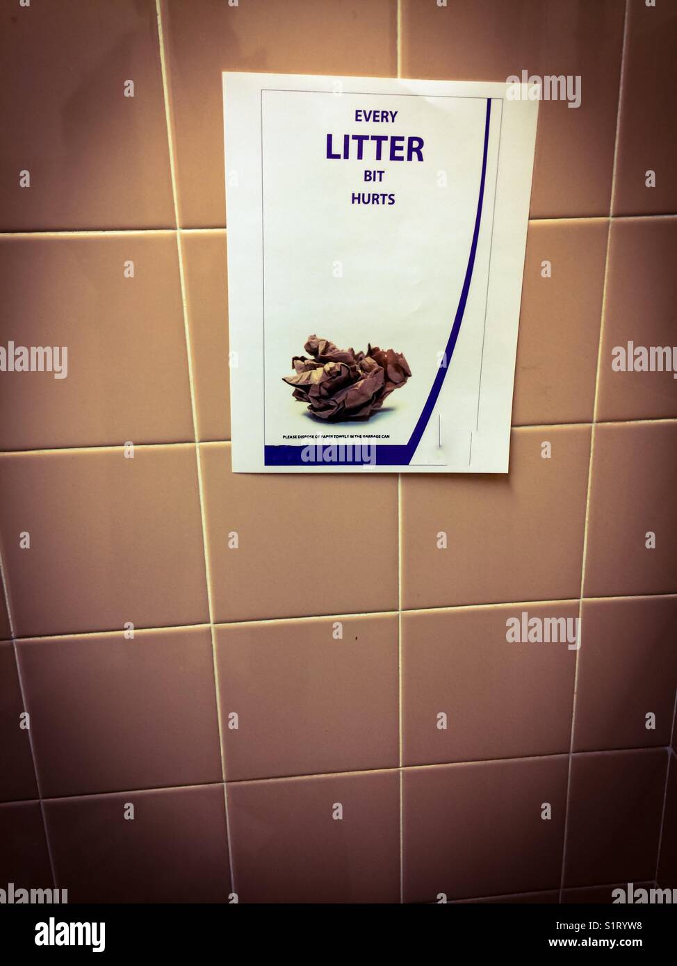 Anti-littering message with a visual representation on a wall. Words ...