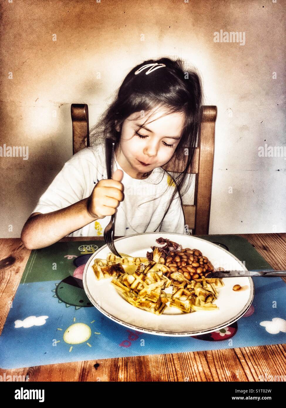 Girl eating baked beans hi-res stock photography and images - Alamy