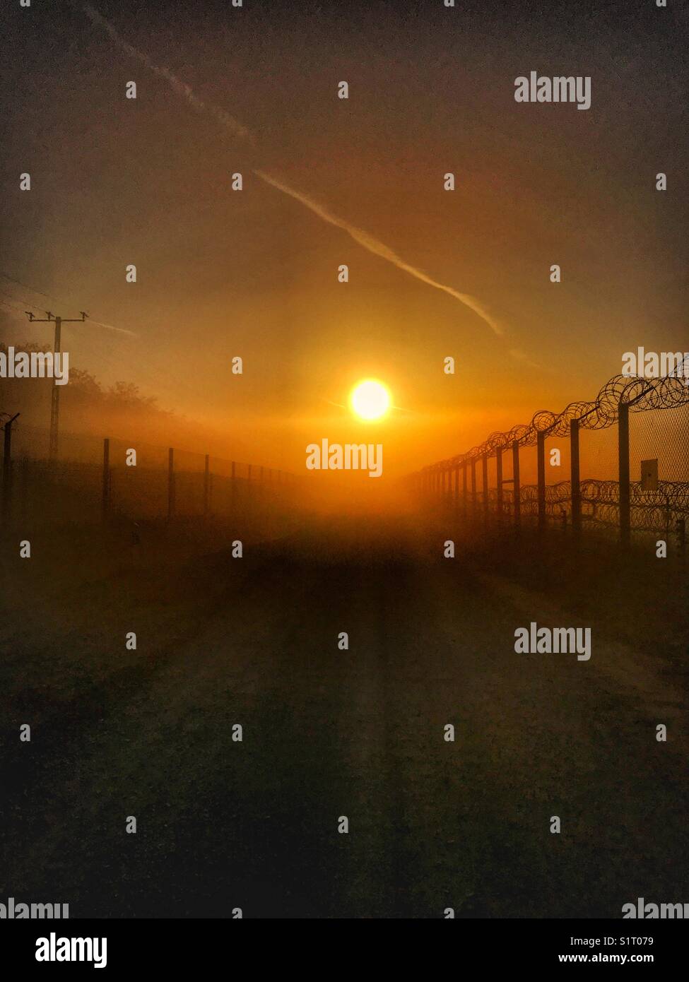 Sunset on the state border Stock Photo - Alamy