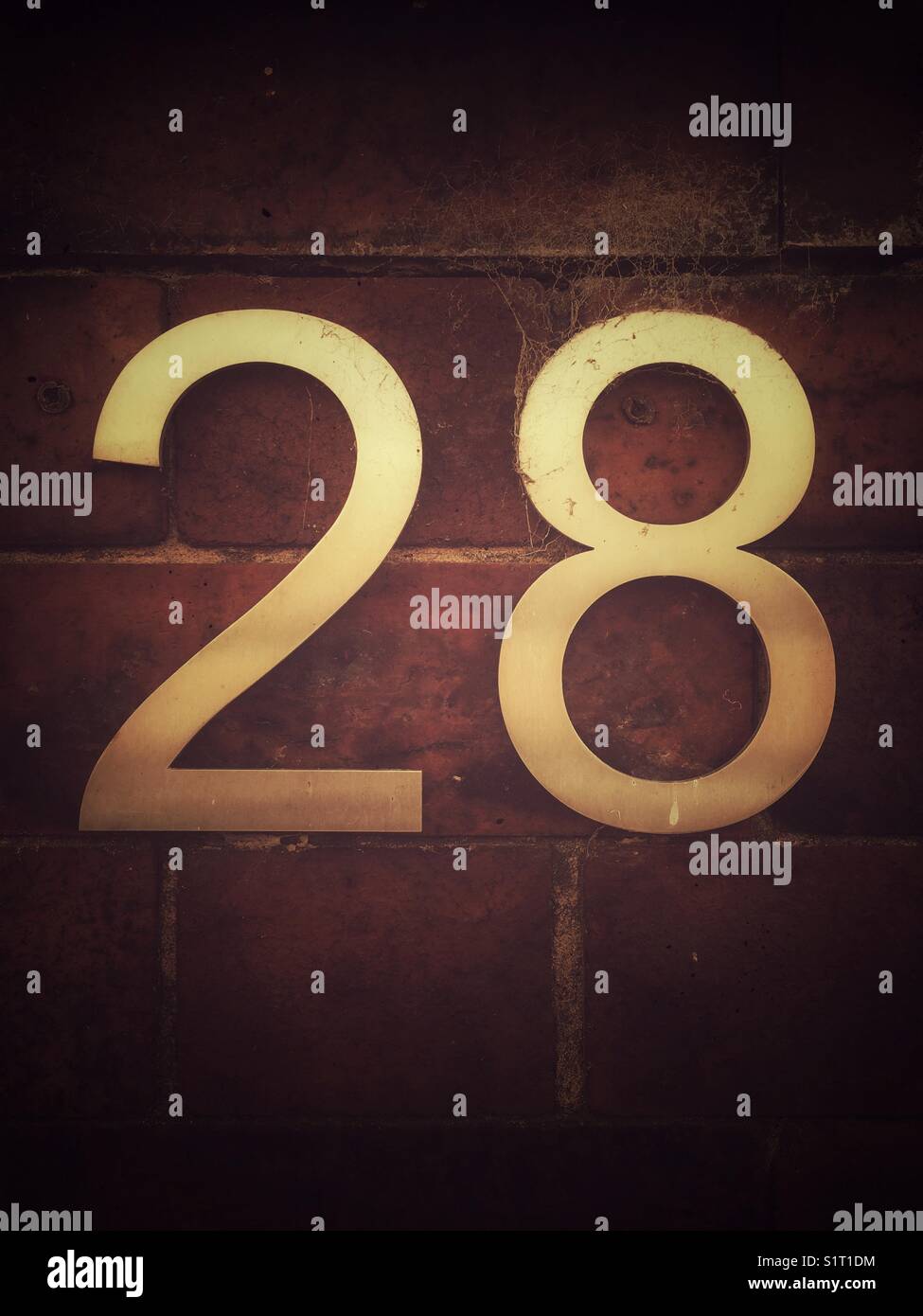 House number 28 on outside wall Stock Photo - Alamy