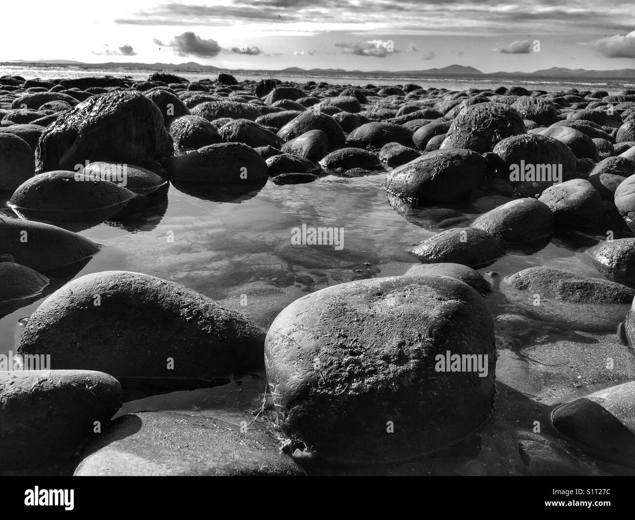 Rocks on Welsh Beach Stock Photo - Alamy